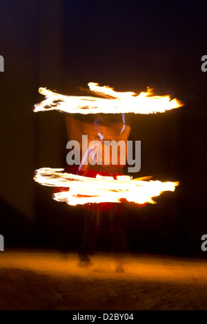 Fire spinners using fire hula hoops Stock Photo - Alamy