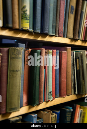 Old used books on bookshelf in library Stock Photo - Alamy