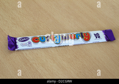 A Cadbury curlywurly ( curly wurly ) chocolate caramel bar on a white ...