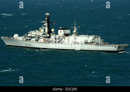 Royal Navy T23 frigate HMS Monmouth (F-235), front, steams alongside ...