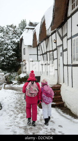 Walking to school on a cold winter morning with pavement covered in ice ...