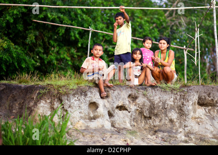Brazilian Amazon local girls, in their families hut in the village ...