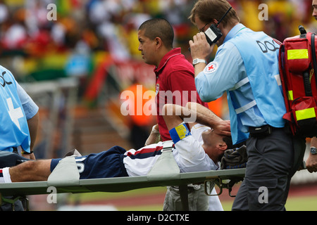 Injured football player being carried off the field by attendants from ...