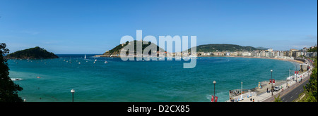 Panoramic view of La Concha bay, beach and waterfront buildings, mount ...