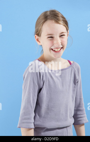 Laughing girl on gray background. Happy young woman portrait Stock ...