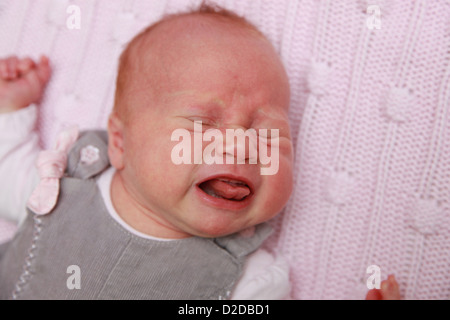 red faced Newborn baby upset and crying Stock Photo - Alamy