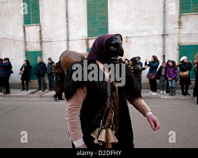 Mamuthones masks on the street at the Mamoiada traditional Carnival ...