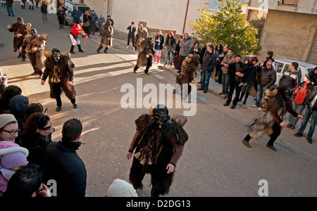 Mamuthones masks on the street at the Mamoiada traditional Carnival ...