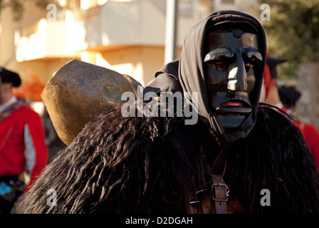 Mamuthones masks on the street at the Mamoiada traditional Carnival ...