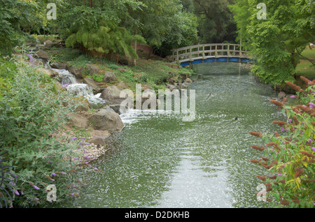 Waterfall and footbridge in Regents Park in London, England Stock Photo ...