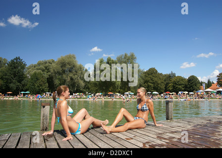 Girls sitting Percha Berg Starnberger See lake starnberg Bayern Deutschland Europe Stock Photo ...
