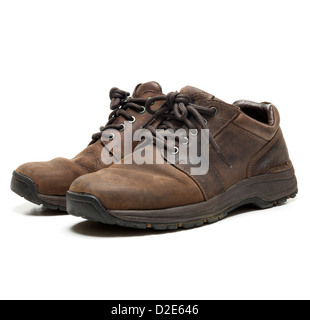 Close up pair of old worn sport sneakers shoes and one basketball ball ...