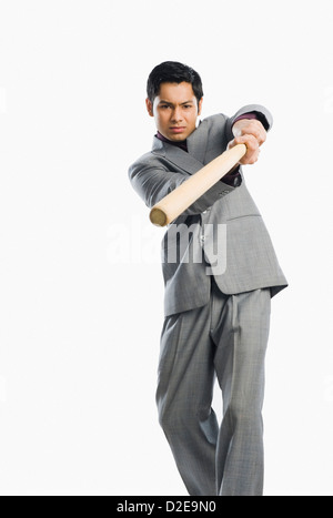 Businessman with baseball bat isolated on white Stock Photo - Alamy
