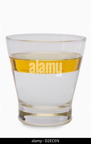 Oil floating on water surface in a glass Stock Photo - Alamy