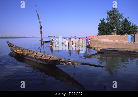 Mali, Niger Inland Delta. A pirogue under sail on the Niger River ...