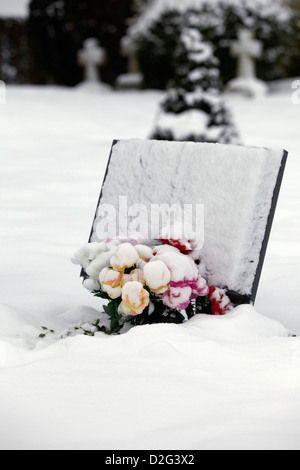 Frost covered graveyard on a winters morning in the churchyard of the ...