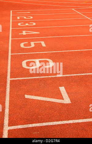 Athlete starting his sprint on an all-weather running track. Runner ...