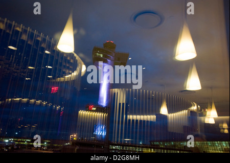 The Control Tower is floodlit at dusk at John F. Kennedy Airport, JFK ...