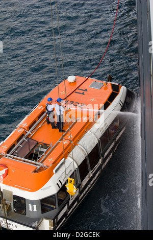 Queen Mary 2 Cunard cruise liner - passengers wave to the shore as the ...