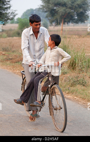 child boys Brothers bike riding bicycles bicycle bikes together Stock ...