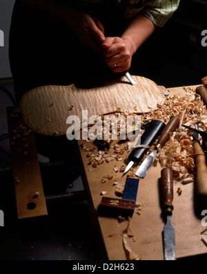 Hands of luthier violin maker carving and working on a instrument ...