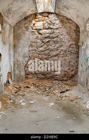 Prison cell rock wall of natural stone with overhead skylight Stock ...