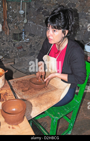 female potter labouring at her workshop Stock Photo - Alamy