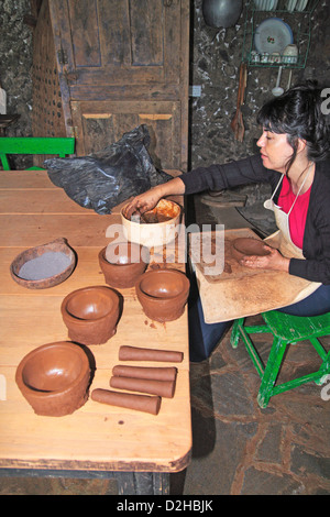 female potter labouring at her workshop Stock Photo - Alamy
