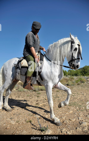 spanish man in his forties and his white Andalusian Gelding outside in ...