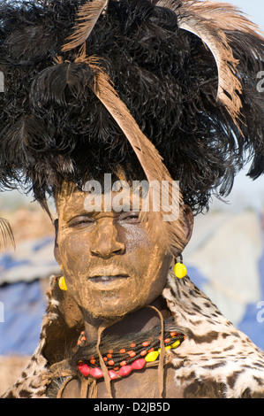 Dassenech man dressed for Dimi ceremony with face and body painted ...