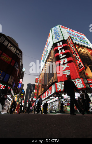 A vertical shot of a neon blue street sign for parking at night Stock ...
