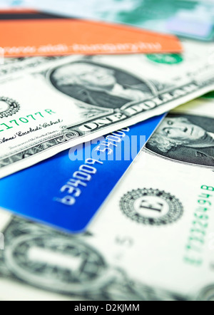 Dollar bills and white debit card with copy space for a text. The ...