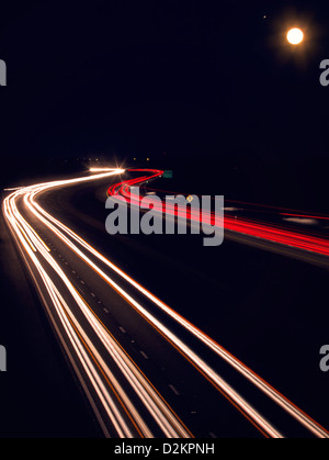 Highway light trails and full moon at night, Pagosa Springs, Colorado ...
