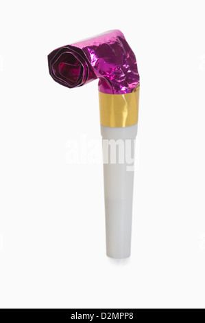 Party blower horn noisemaker rolled for birthday isolated on the white ...