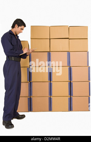 Store incharge checking inventory Stock Photo - Alamy