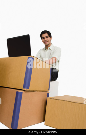Store incharge using a laptop in a warehouse Stock Photo - Alamy