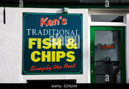 A sign advertising a fish and chip shop in a street in Newquay Stock ...