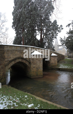 Winter snow, river Chater stone bridge, St Marys church, Ketton village ...