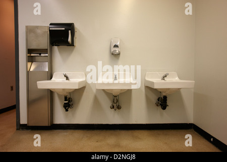A row of sinks in a public washroom bathroom, restroom, latrine ...