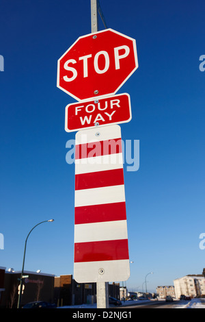 4 way Four way stop sign at intersection, residential neighborhood ...