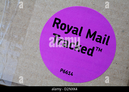 Royal Mail tracked TM purple sticker on parcel with green tape Stock ...