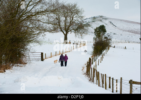 Two walkers heading towards Gaerstone in Winter Snow, Church Stretton ...