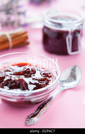 Homemade plum chutney in glass jar on wooden table Stock Photo - Alamy