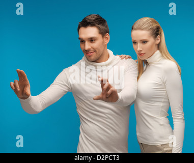 man and woman working with something imaginary Stock Photo - Alamy