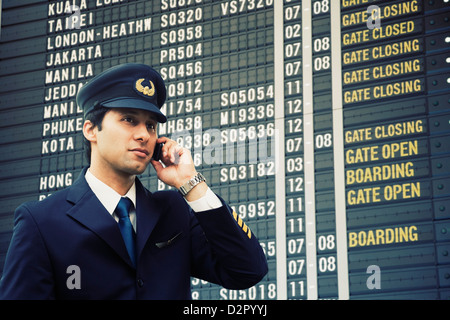 Pilot Using Cell Phone In Cockpit Stock Photo - Alamy