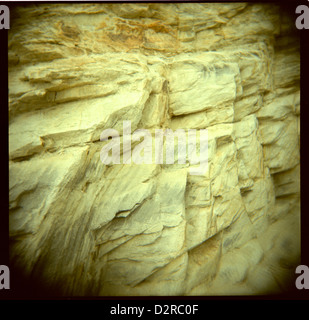 Close up on jagged cliff, with exposed rock in the cliff face Stock ...