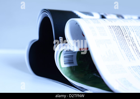 Two magazines folded to heart shape on table Stock Photo - Alamy