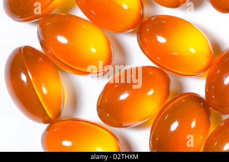 Orange vitamin supplements look very colorful when photographed close ...