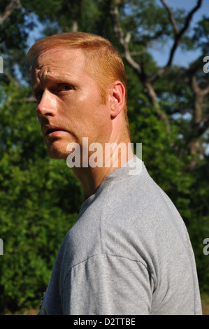 Scared man looking over his shoulder Stock Photo - Alamy