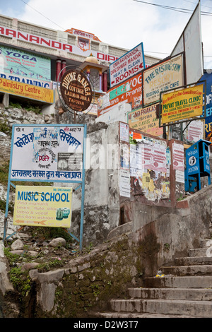 India, Rishikesh. Advertisements near the footbridge over the Ganges ...